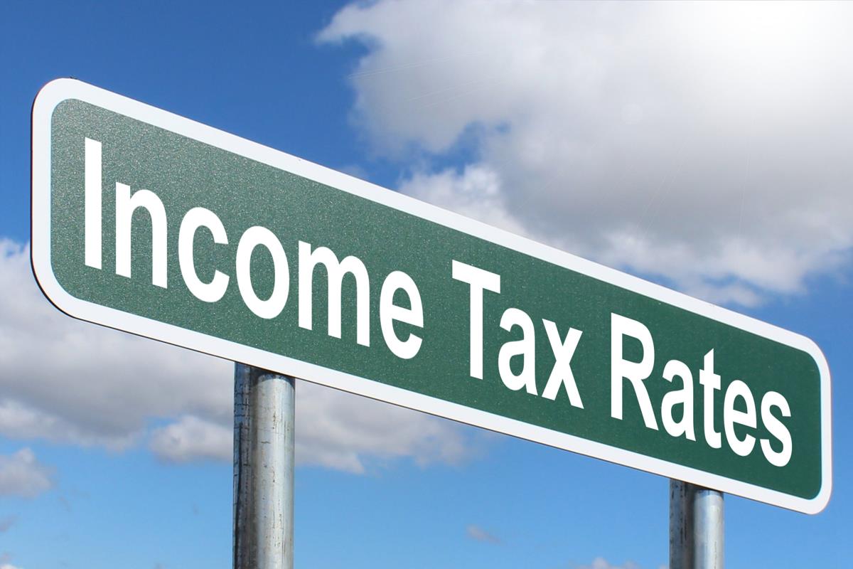 Income Tax Rates Free Of Charge Creative Commons Green Highway Sign Image